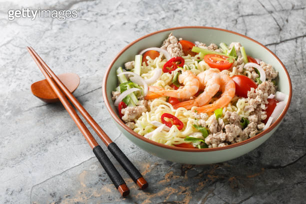 Thai Yum Mama salad with instant noodles, shrimp, minced pork, tomatoes ...
