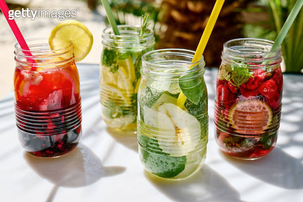 Detox drink. Different varieties of infused water with lemon, berries ...