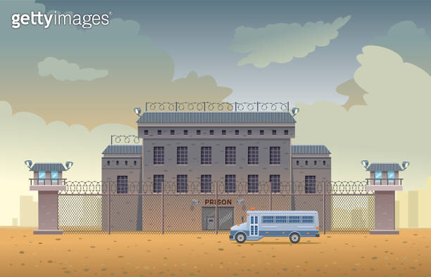 Guarded city prison building with two watchtowers with barbed wire ...