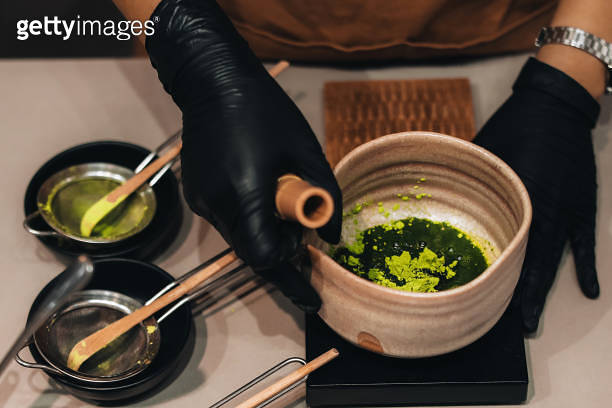 Matcha green tea making process. Still life with organic Japanese ...