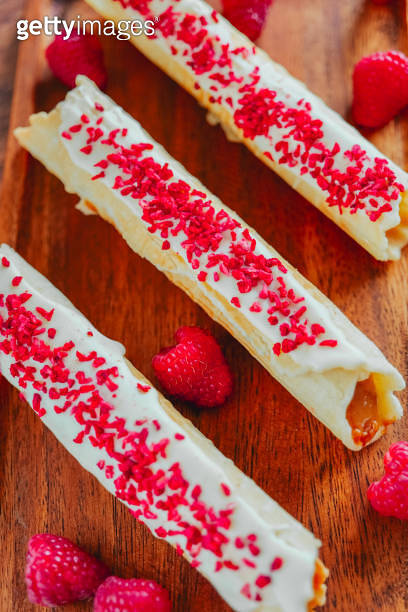 Wafer pastries with sublimated berries. Wafer rolls with butter cream ...