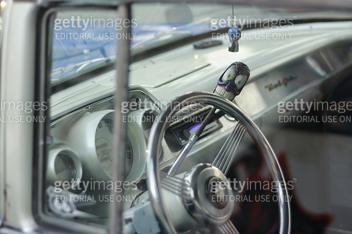 Variation lever with cartoon figure near the steering wheel on a ...