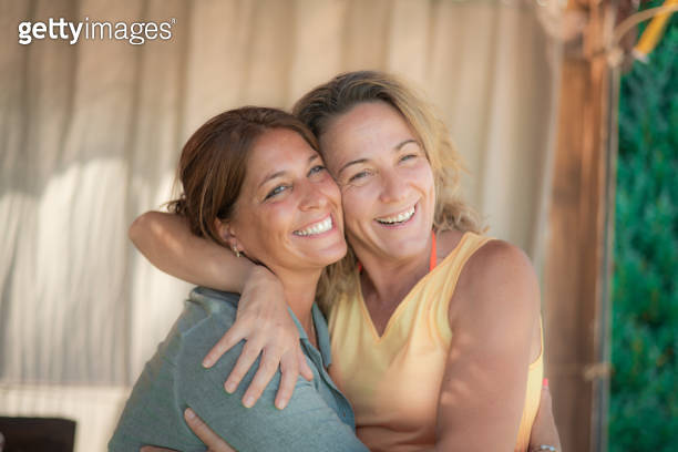 Friendly Embrace Between Two Mature Women. Two Female Friends Hugging ...