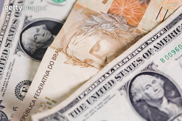 Brazilian Real note of 50 Reais with a dollar note from the United ...