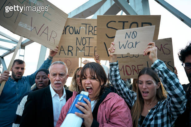 Gen z woman shouting angry with megaphone slogans against wars in world ...