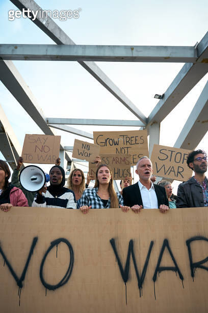 Multiracial diverse ages people protesting against war and violence in ...