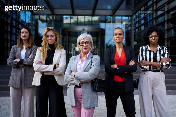 Group empowered diverse business formal women standing with arms ...