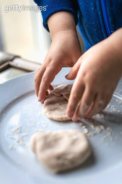 Child having fun modeling dough, authentic activity for fine motor ...