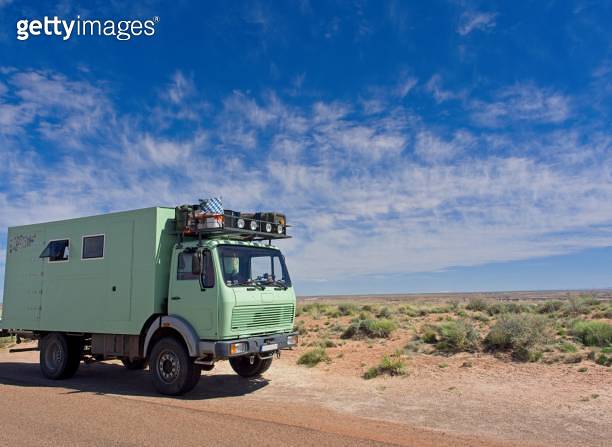 Survivalist earth crawler vehicle in the vast painted desert of Arizona ...