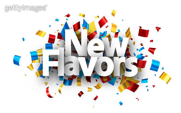 New flavors sign with colorful cut out foil ribbon confetti background ...