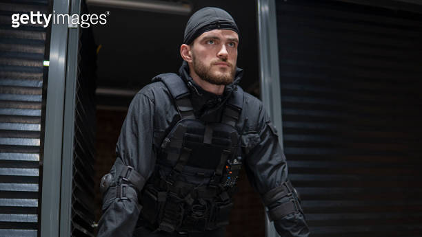 In this compelling shot, a highly trained special operations officer ...