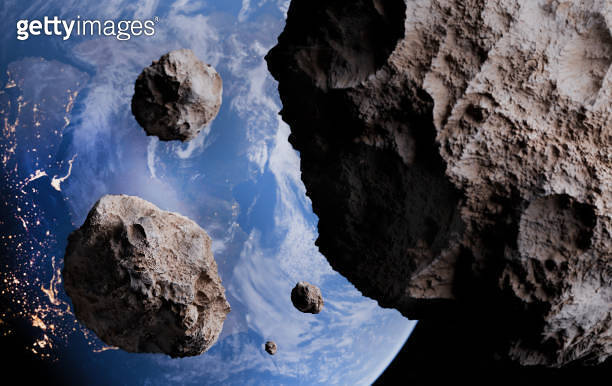 Blue Earth and asteroids in the space. View of planet Earth from space ...