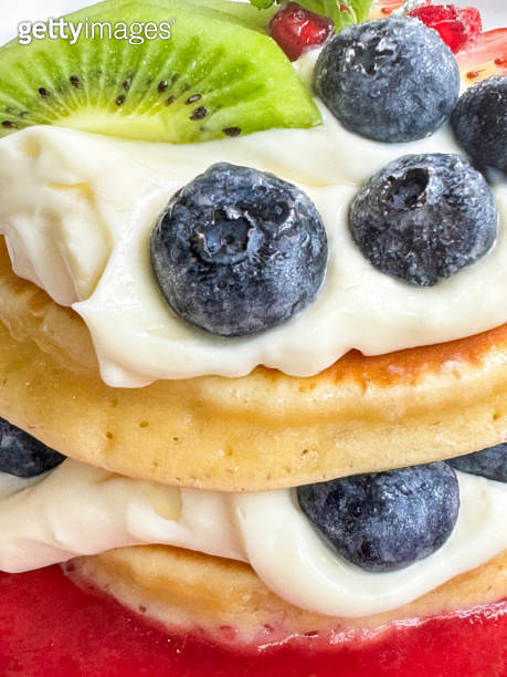 Full frame image of two, stacked fluffy, American-style pancakes ...