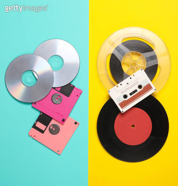 Retro attributes from the 80s. Magnetic tape reel, audio cassette, cd ...