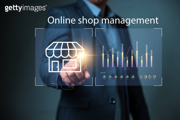 Online shop management, Businessman using software to manage a shop and ...