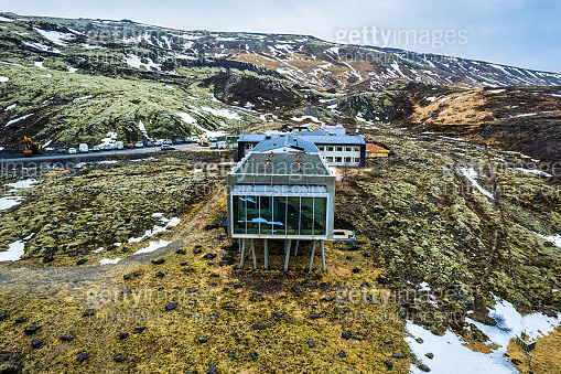 Aerial view of luxury modern hotel on mount hengill among lava field in ...