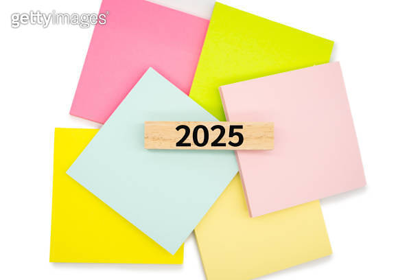 2025 text wooden block on colorful sticky note. 2025 new year idea ...