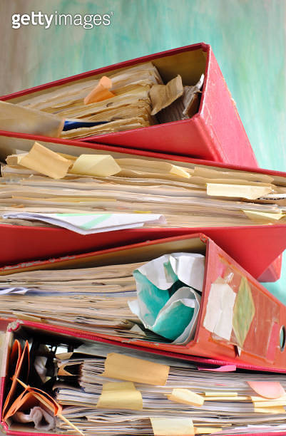 messy file folders and business records ,red tape, bureaucracy ...