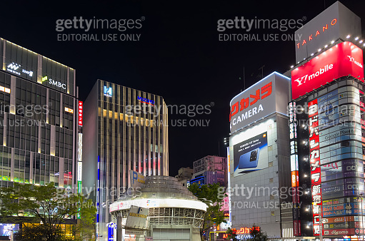 Tokyo Japan. Big billboard with camera ad, illuminated building with ...