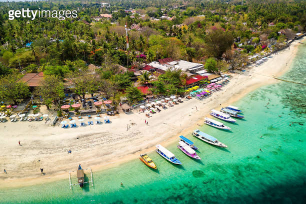 Aerial view of the upper reef flat of a fringing coral reef on a small ...