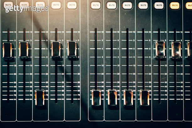 Audio mixer faders with mute buttons, professional sound equipment used ...