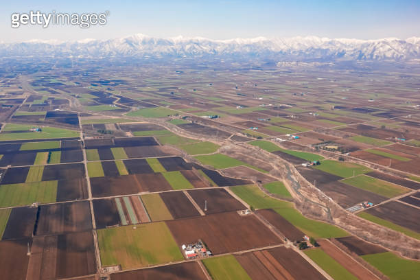 Fields of the Tokachi Plain seen from the plane window before landing ...