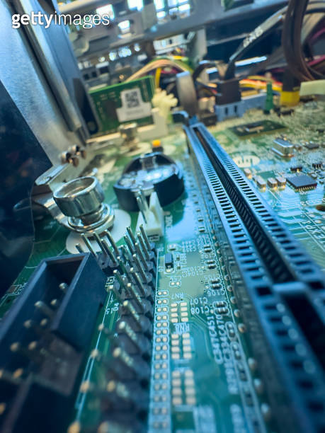Close up of circuit board with microchips and other computer parts ...