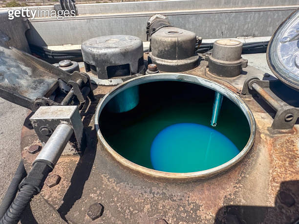 Open upper filling hatch of a tanker truck loaded with diesel, where ...