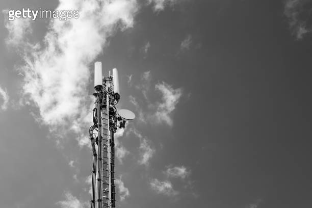 Newly installed 5g cellular tower showing the various supply cables ...