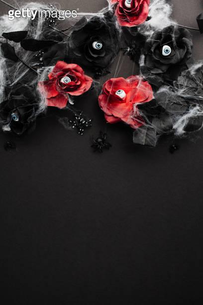 Gothic Halloween vertical background with red and black roses decorated ...