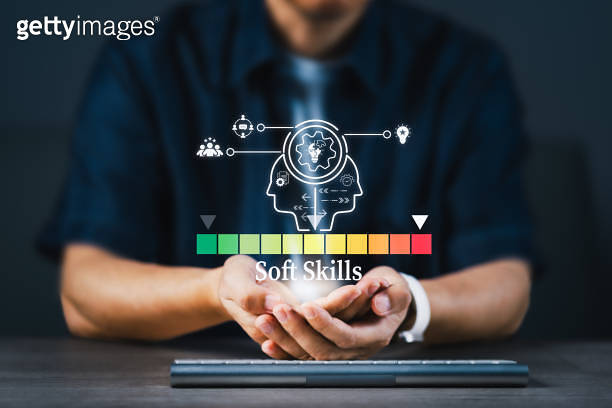 A man is holding a graph showing a scale of soft skills level and white ...