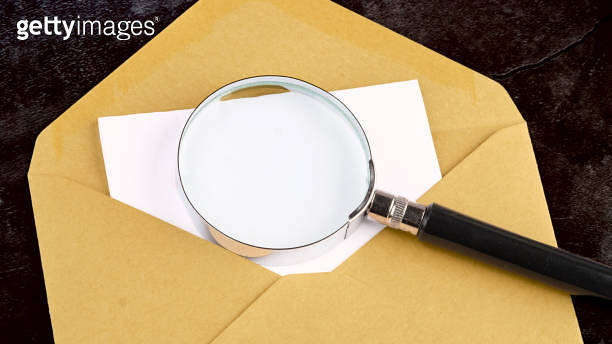 Magnifying glass on top of the secret note with a place to copy on the ...