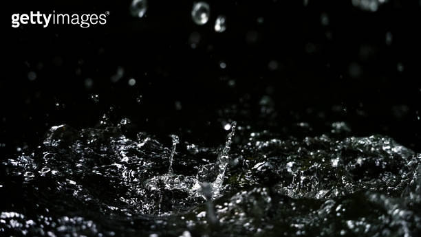 Water splash on black background color which represent clean and pure ...
