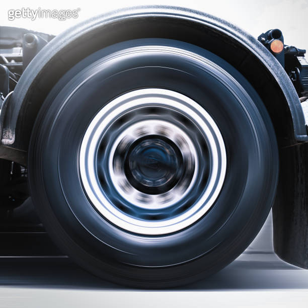 Fast Spinning Truck Wheels on The Road. Rubber, Tractor Truck Wheel ...