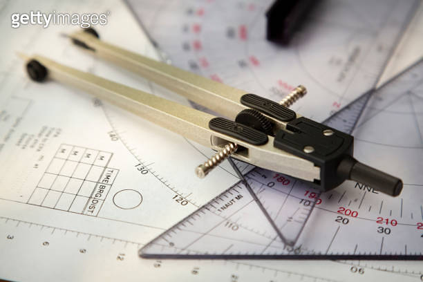 Above image of a navigator's radar plotting chart with a triangle and ...