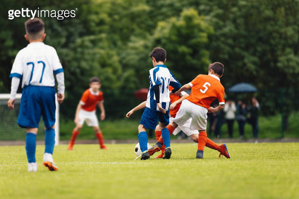 Football Teams Compete in Youth Soccer League. Children Play Soccer ...