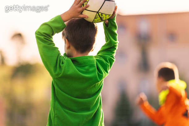 Little Boy Throw In a Soccer Ball During Youth League Football Match ...