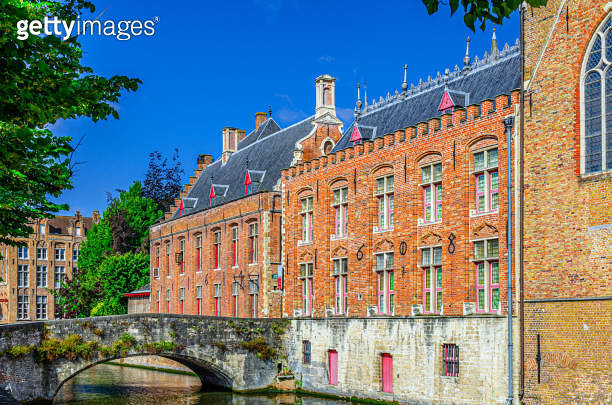 Blinde-Ezelbrug stone bridge across Groenerei Green Canal water of Reie ...