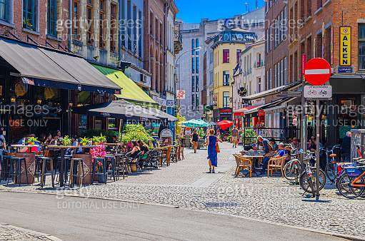 people tourists in street restaurants and terraced cafes in Antwerpen ...