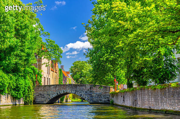 Meebrug stone bridge across Groenerei Green Canal water of Reie river ...
