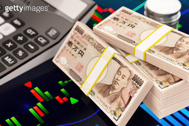 Japanese Economy Concept with a Calculator and Japanese Yen Banknotes ...