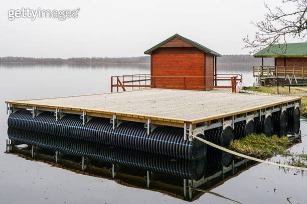 Large floating wooden platforms on pontoons with holiday houses in the ...