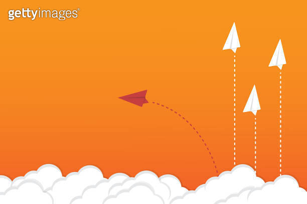 Think differently concept. Red airplane changing direction. New idea ...