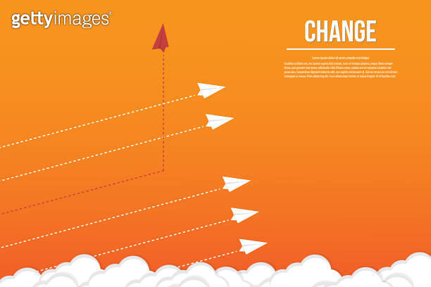 Think differently concept. Red airplane changing direction. New idea ...