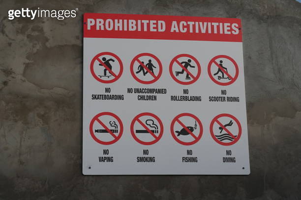 Poster depicting prohibited activities in the vicinity of the passenger ...