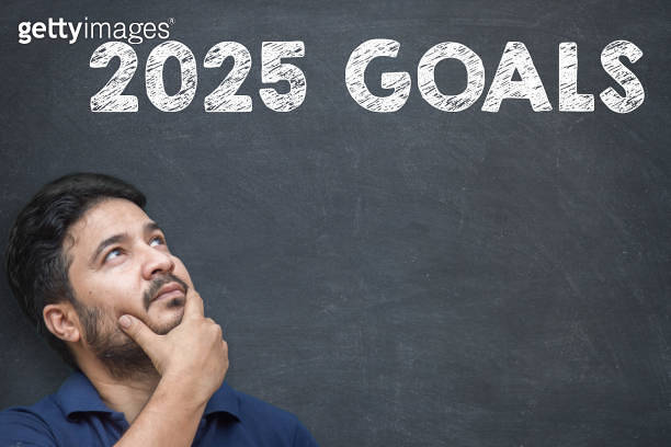 Man reflecting on personal and professional goals for 2025 with a ...