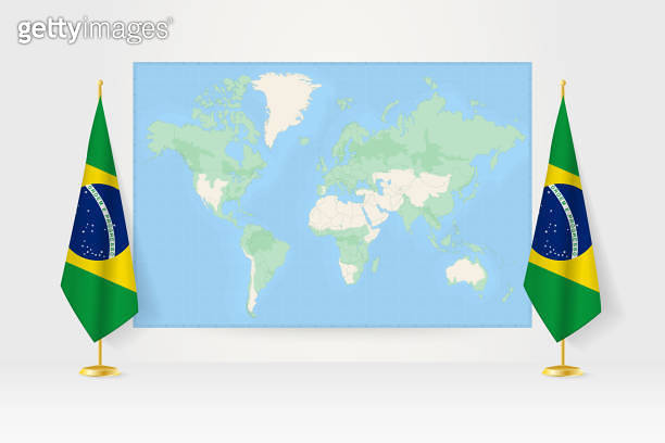 World Map between two hanging flags of Brazil flag stand. 이미지 ...