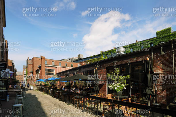 People enjoying the outdoor summer dining at restaurants along Wharf St ...