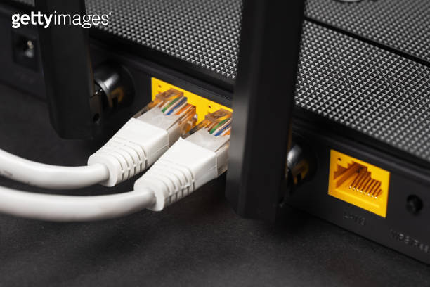 Connect an Ethernet Cable to a Wireless Router on dark. Ethernet, rj45 ...
