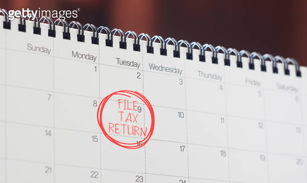 Tax filing and payment of income tax. Hand written reminder to File Tax ...